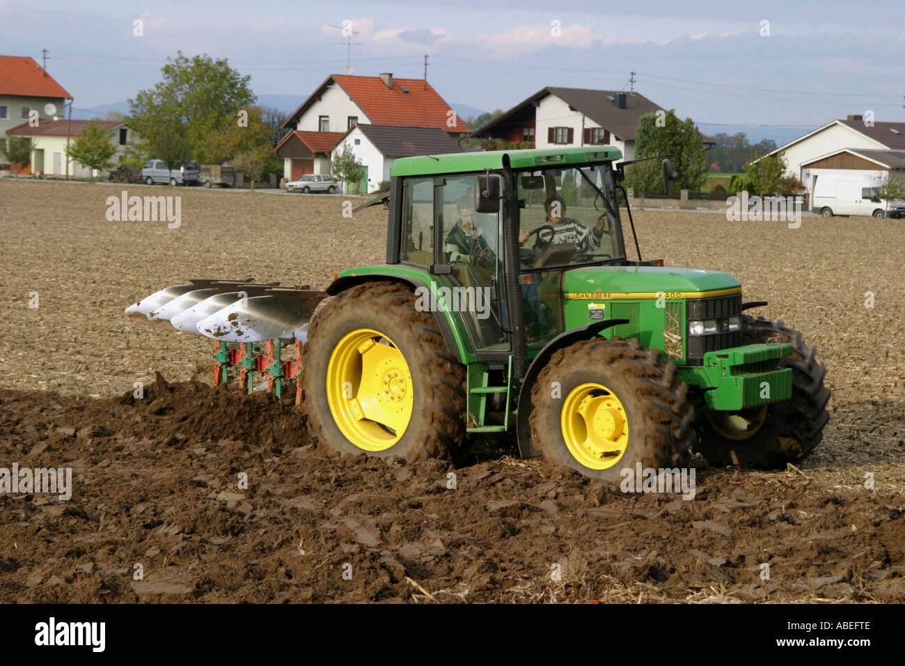 Tractor at the farm work Stock Photo - Alamy