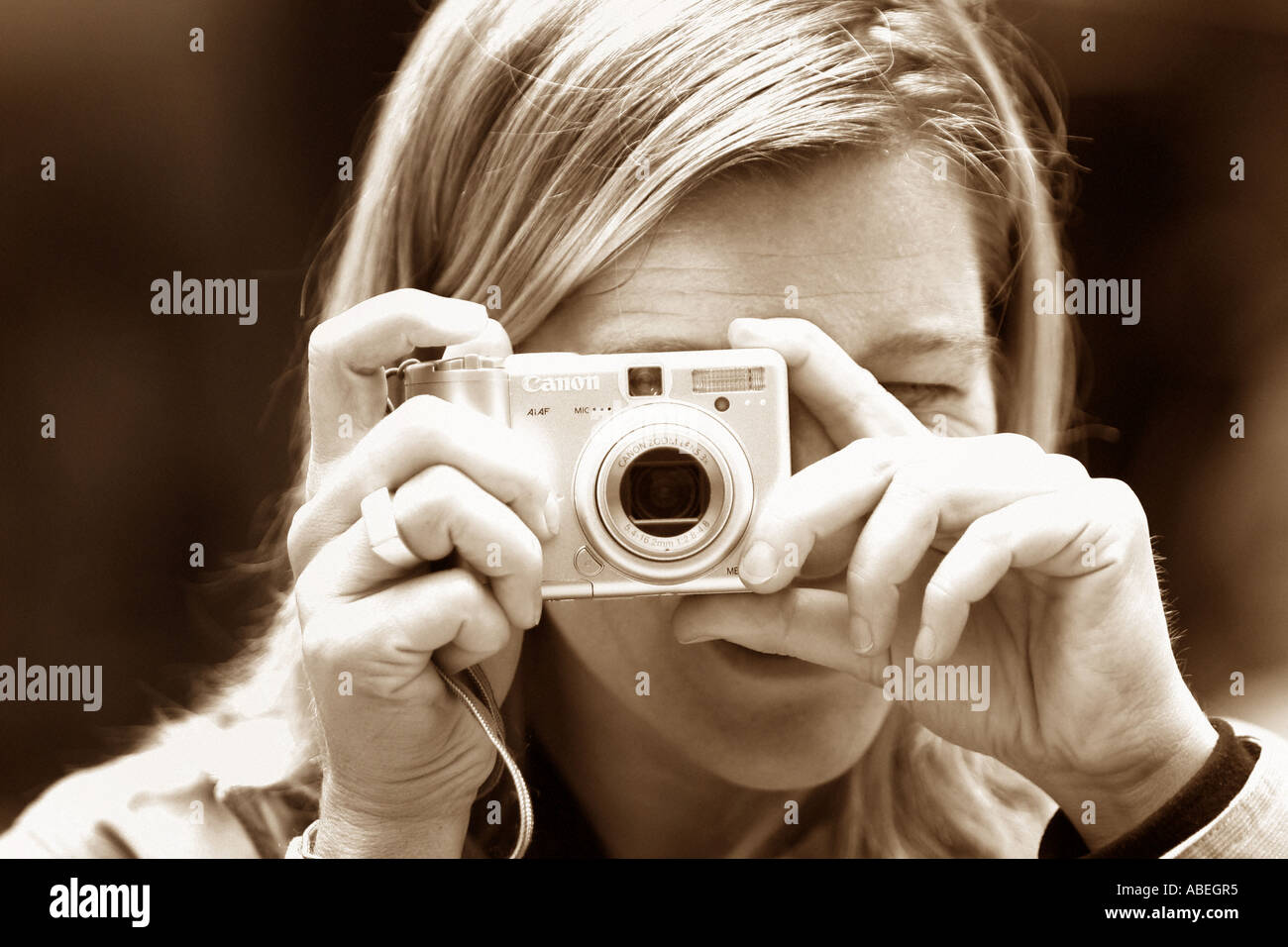 Woman photographs with digital camera Stock Photo - Alamy