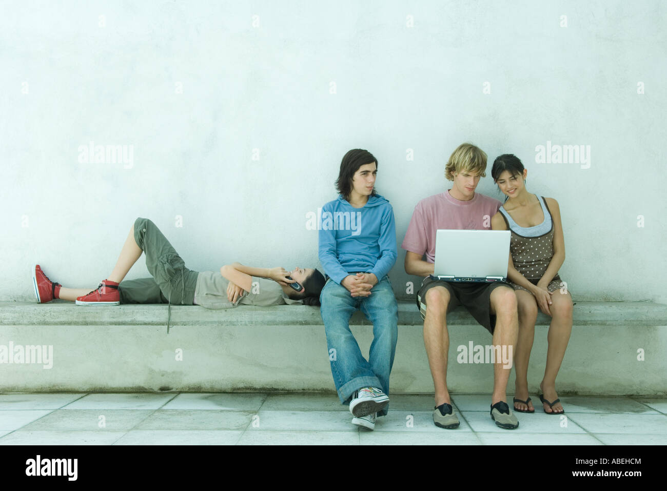 Friends Sitting Around Laptop High Resolution Stock Photography and ...