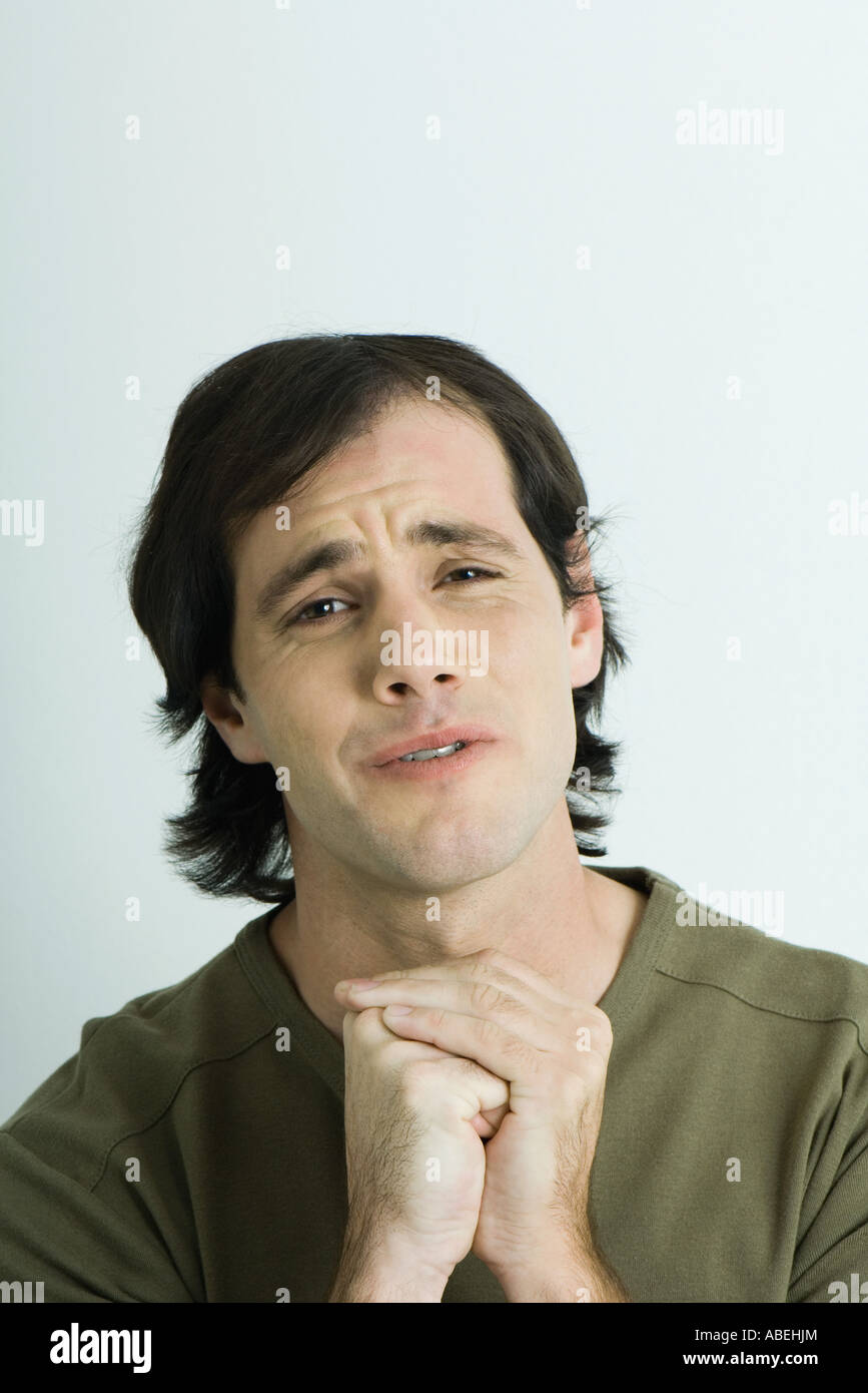 Man pleading, head and shoulders, portrait Stock Photo - Alamy