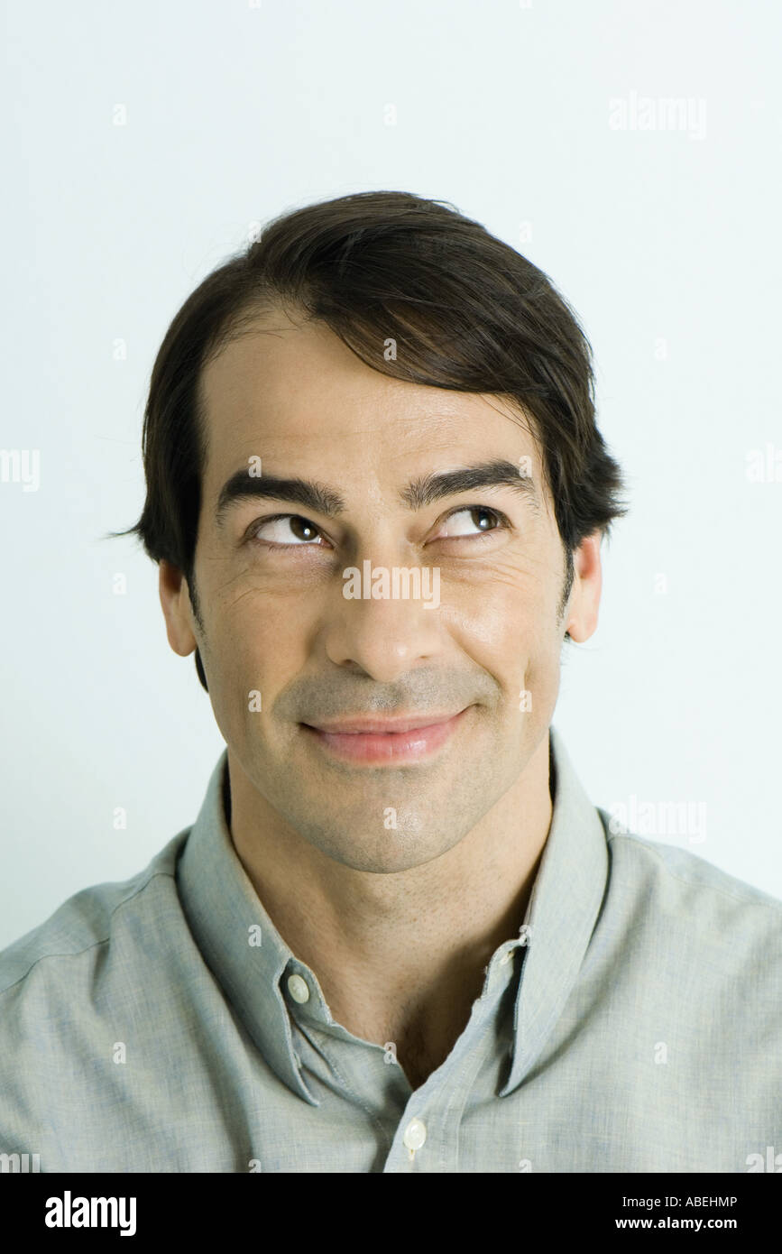 Man looking up and smiling, head and shoulders, portrait Stock Photo ...