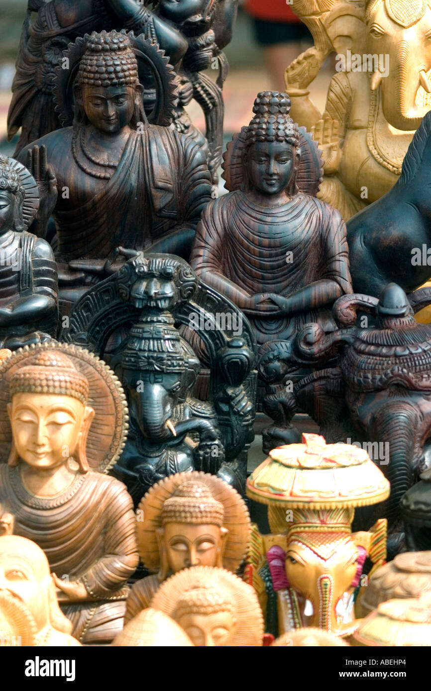 Wooden idols of the Buddha and Hindu Gods Stock Photo - Alamy