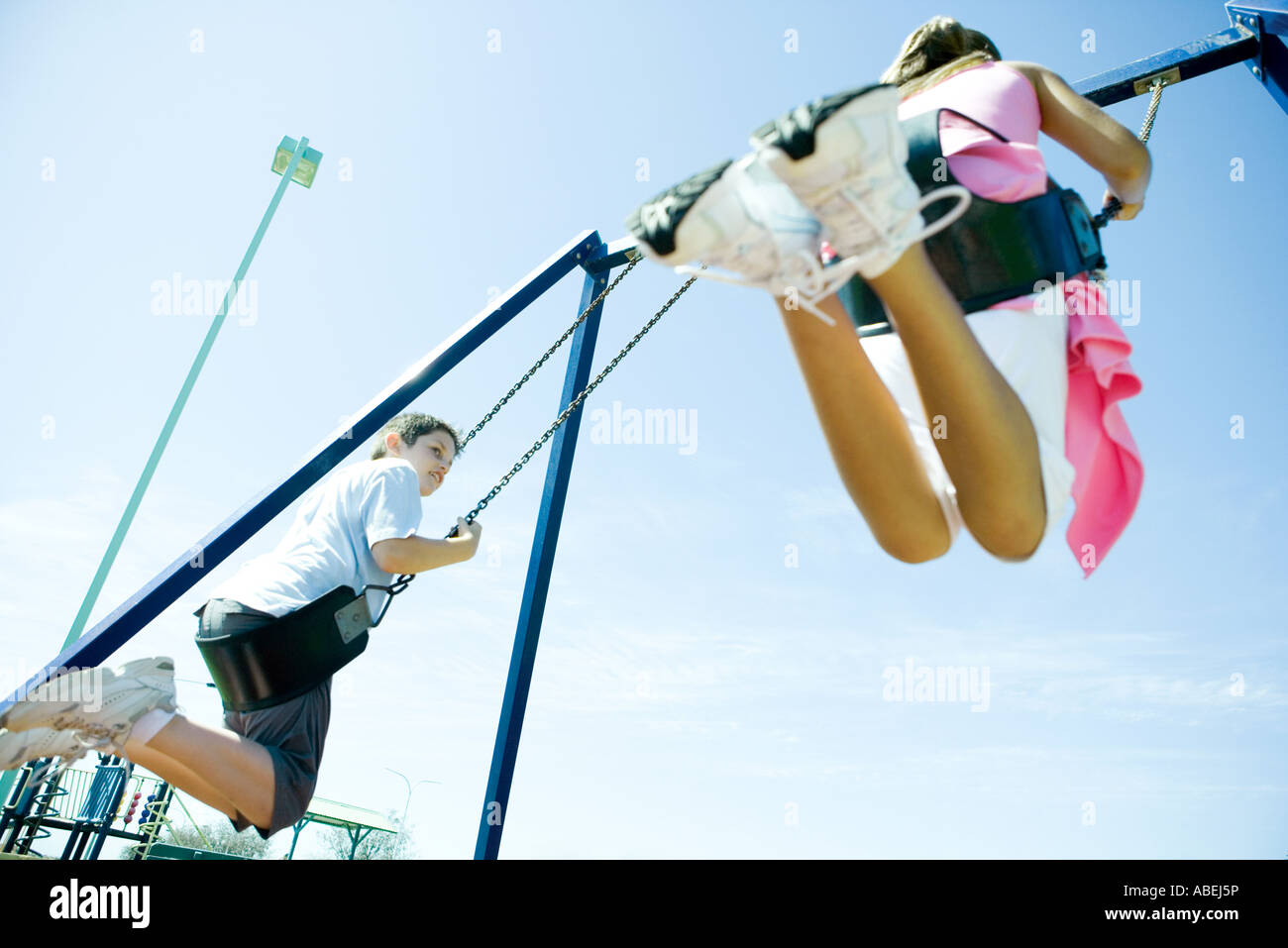 Children on playground swings Stock Photo - Alamy