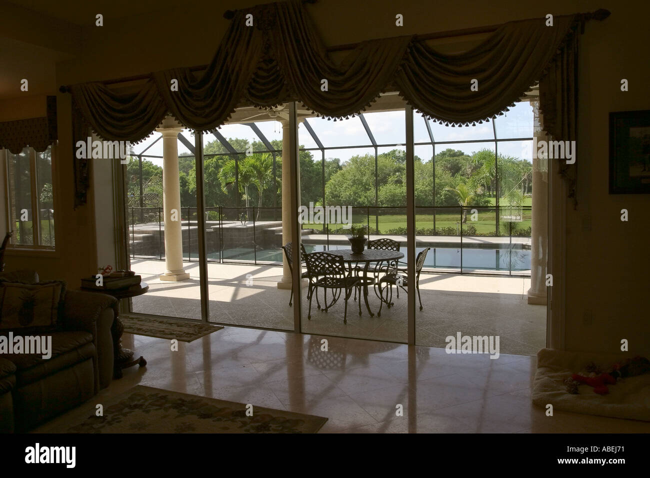 Lovely interior and glassed-in swimming pool is scenic Florida USA ...
