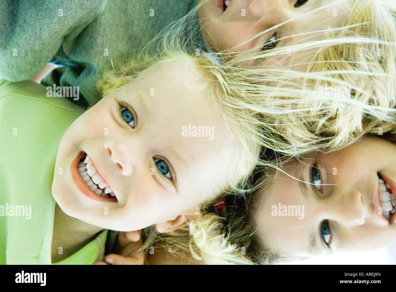 Children huddling, low angle view Stock Photo - Alamy