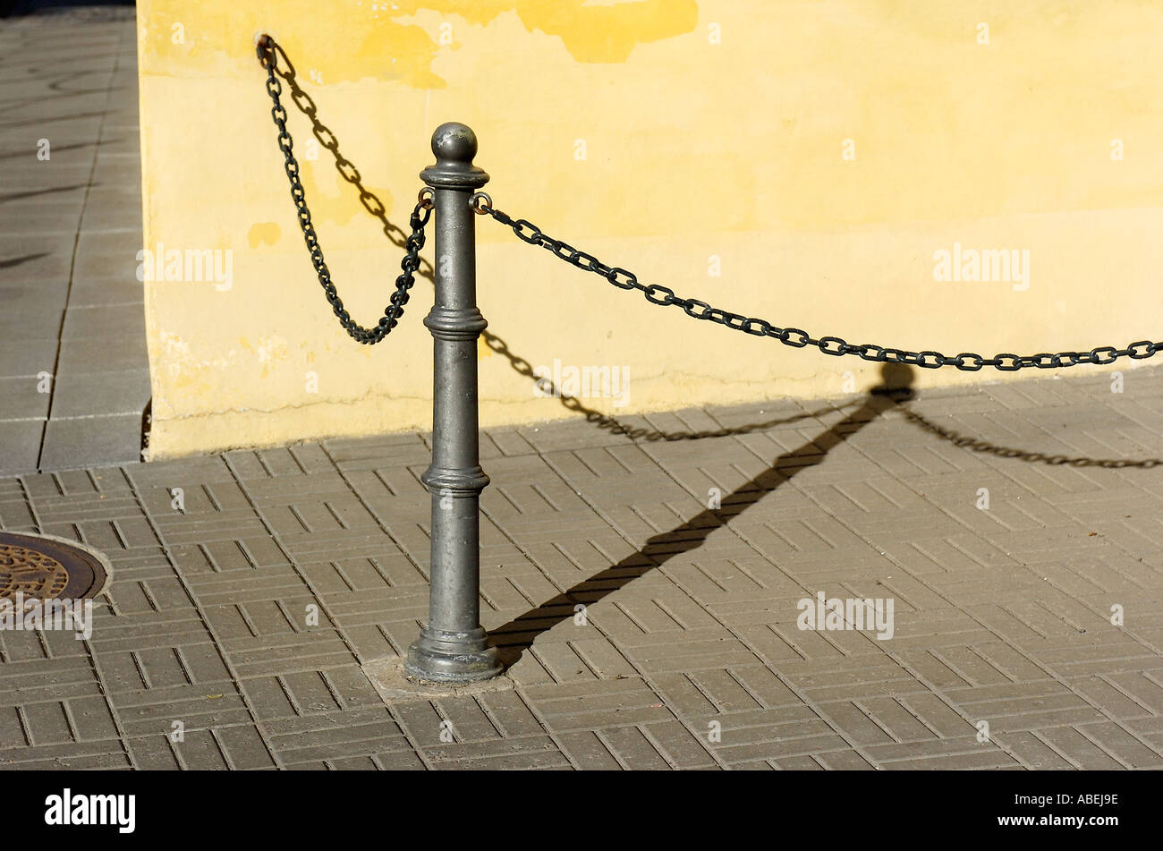 Shadows of iron pole and chains Stock Photo - Alamy