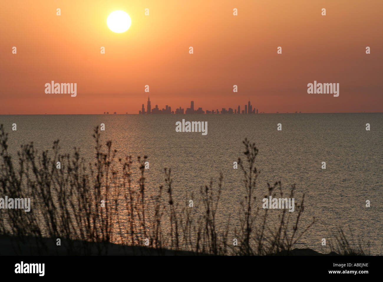 Sun setting on Chicago skyline Stock Photo - Alamy