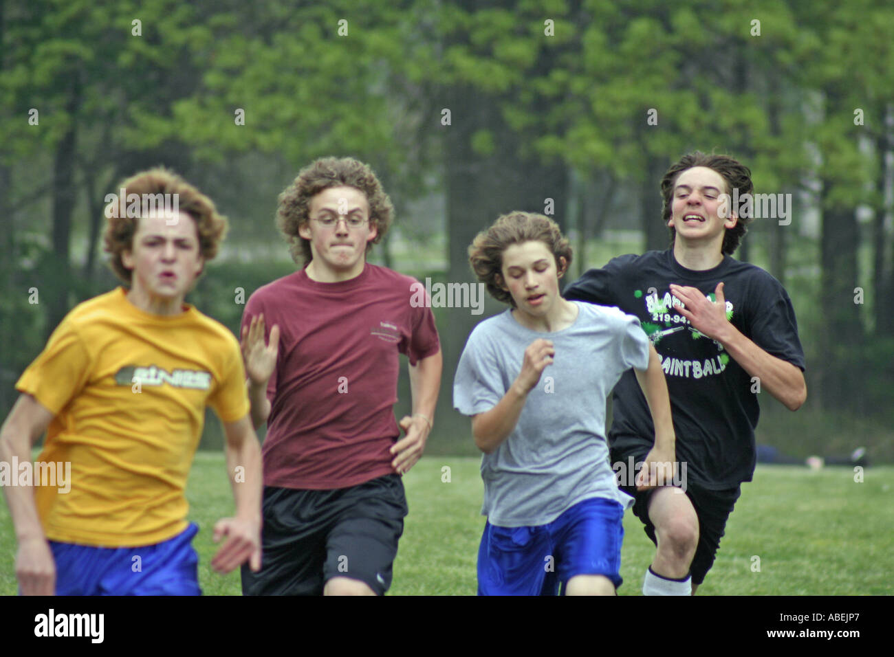 Group of Teen Boys Competing in Outdoor Running Race on Field Stock ...