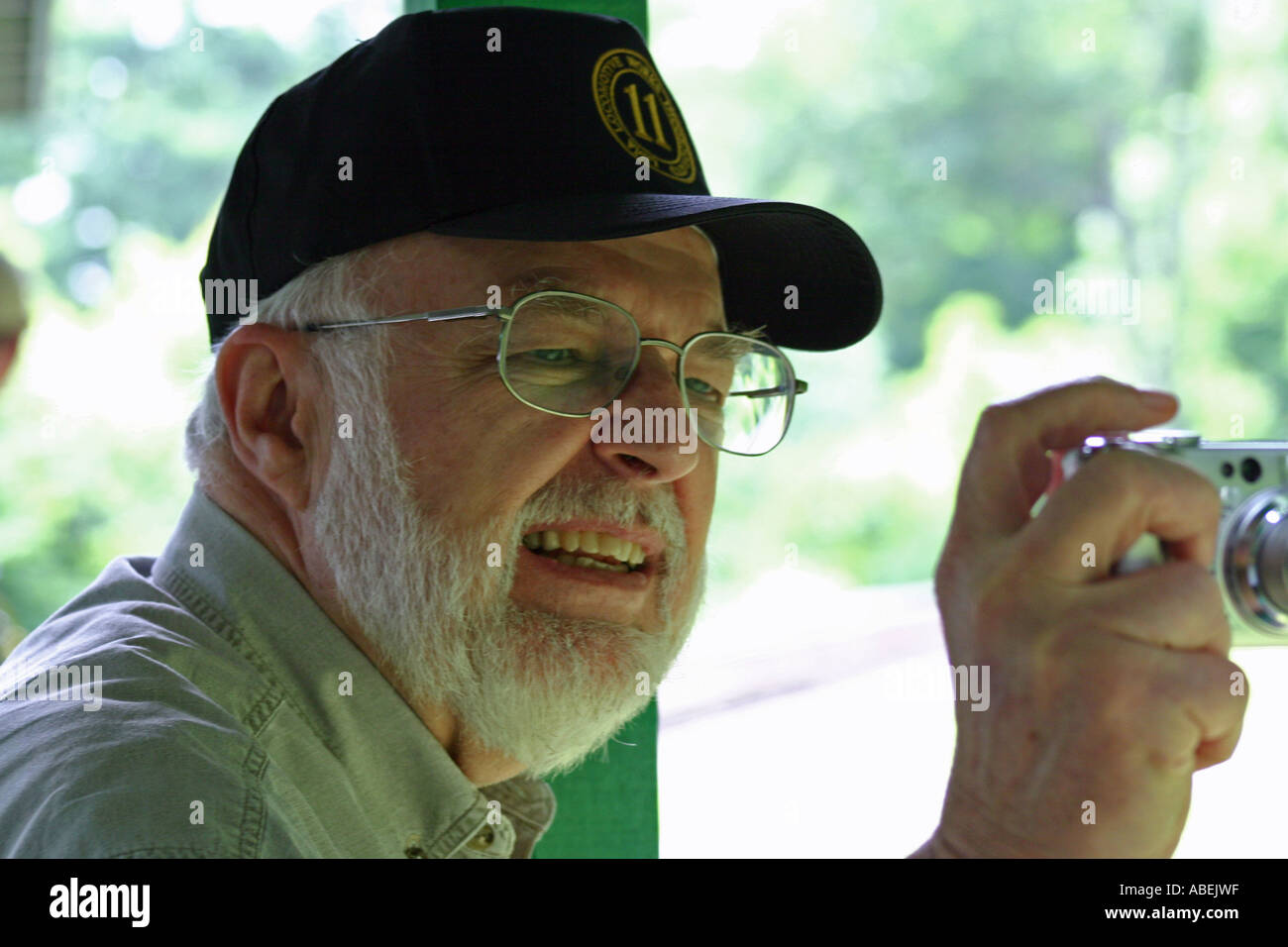 Senior photographer using digital hi-res stock photography and images ...