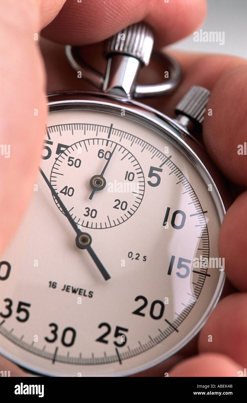 HAND HOLDING STOP WATCH Stock Photo - Alamy