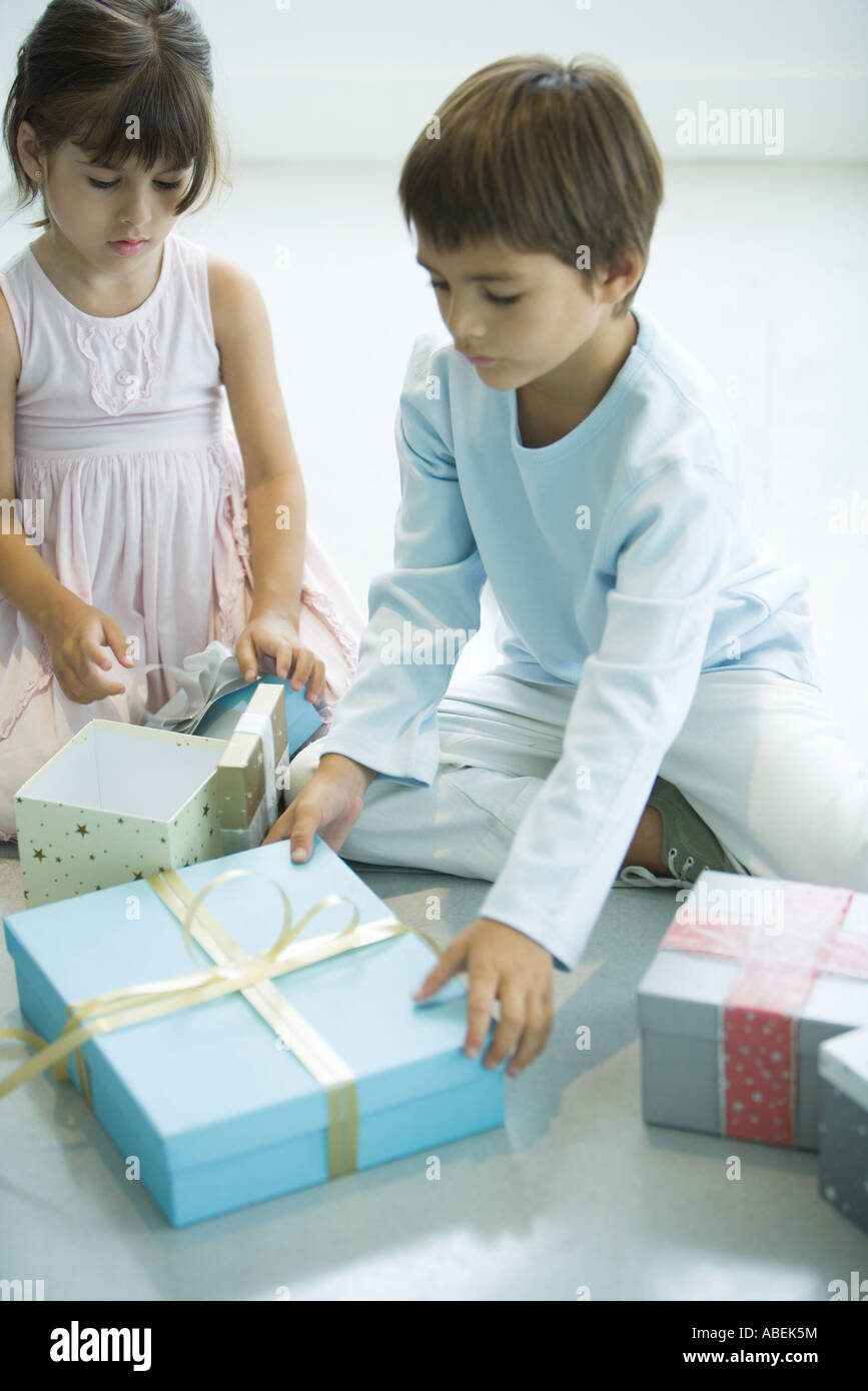 Kids reaching into box hi-res stock photography and images - Alamy