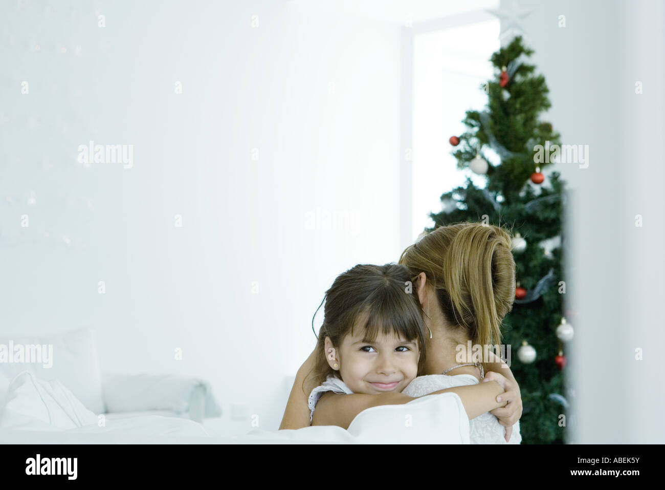 Rear view of parents hugging child hi-res stock photography and images ...