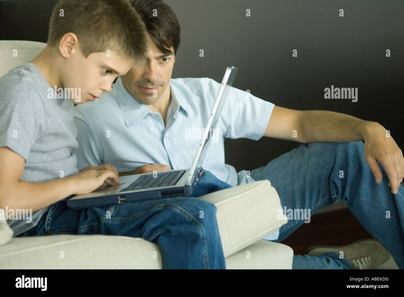 Father son using laptops looking hi-res stock photography and images ...