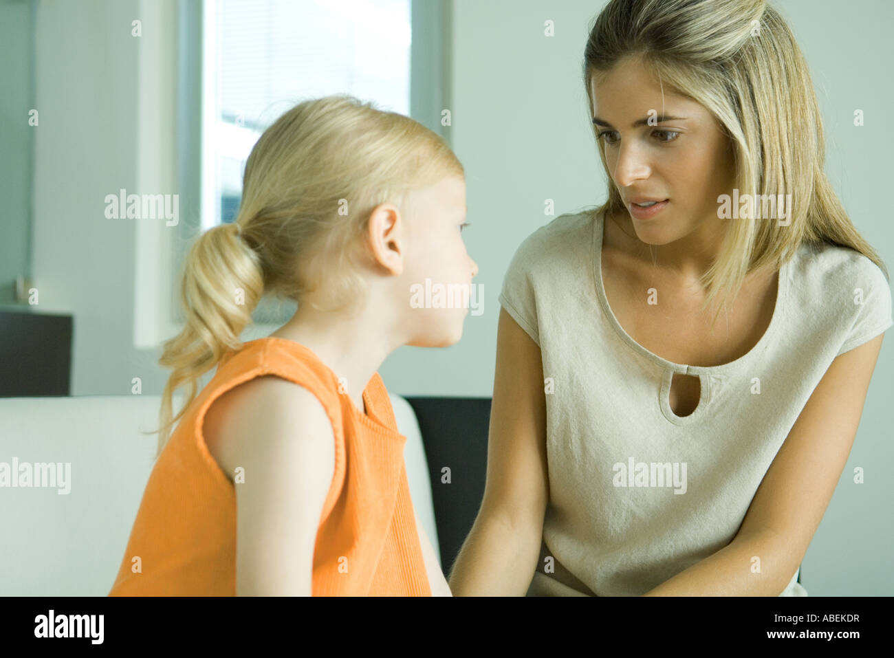 Mother and daughter talking together Stock Photo - Alamy