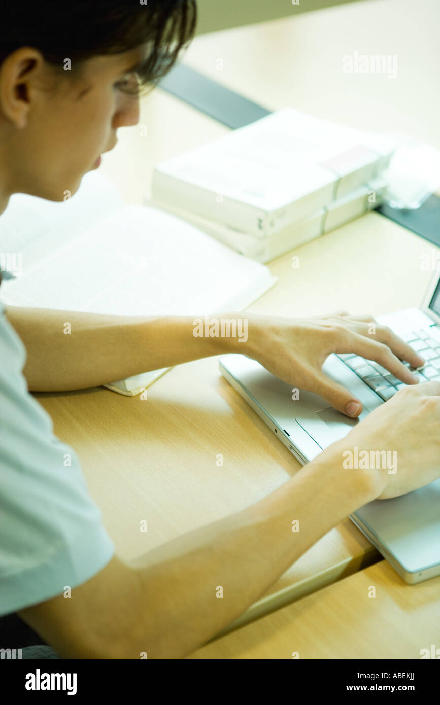Male college student using laptop Stock Photo - Alamy