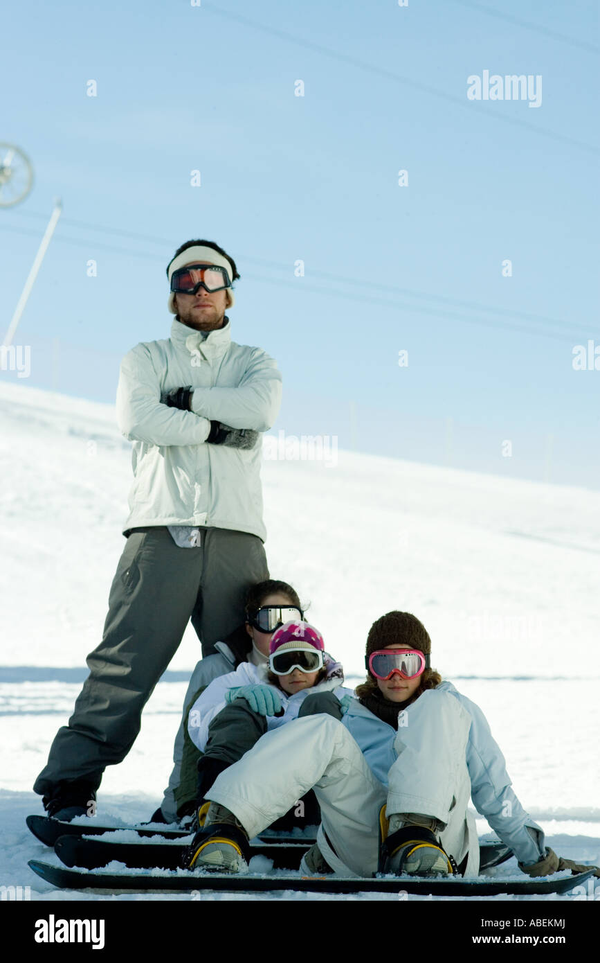 Young snowboarders on ski slope, full length portrait Stock Photo - Alamy