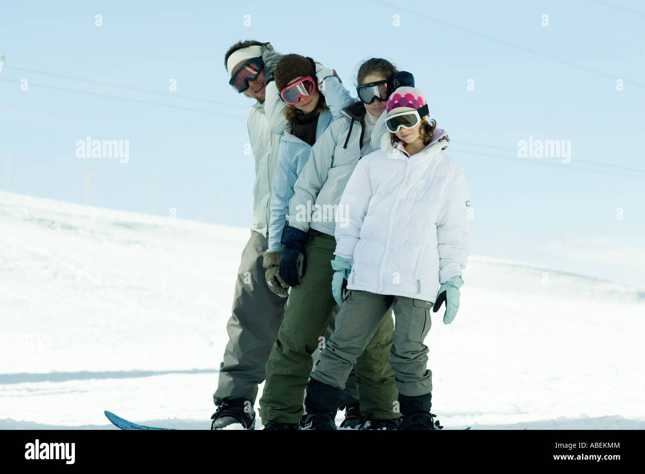 Young snowboarders standing on ski slope, full length portrait Stock ...