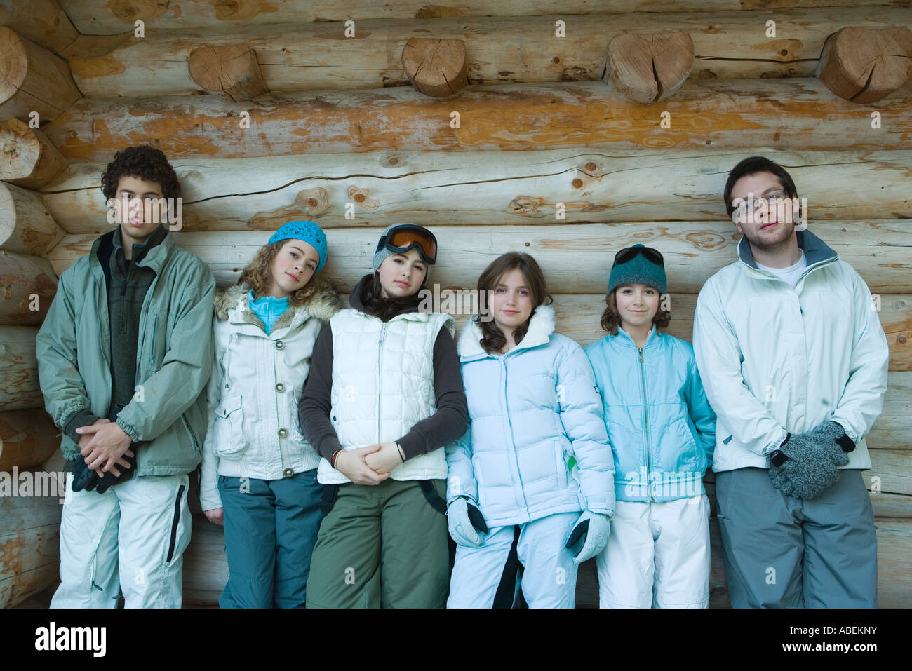 Young friends standing by log cabin, portrait Stock Photo - Alamy