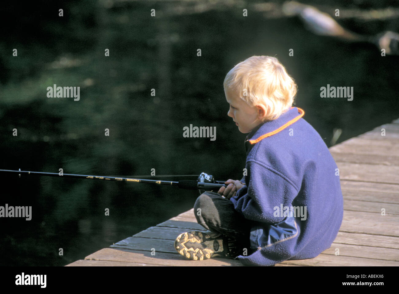 Small child fishing hi-res stock photography and images - Alamy