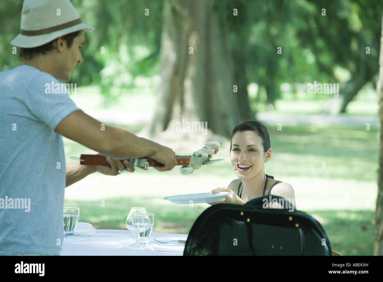 Woman holds out plate hi-res stock photography and images - Alamy