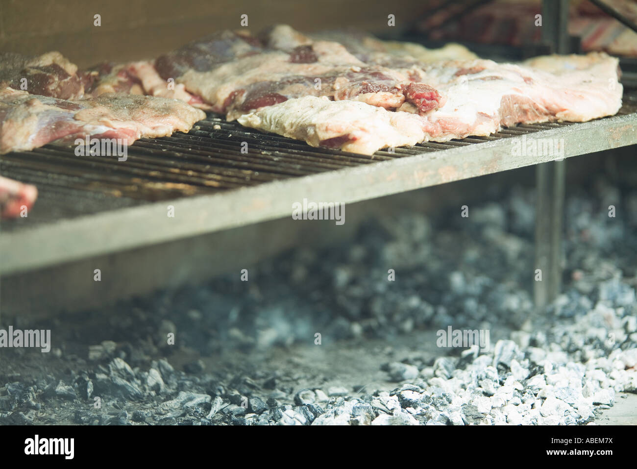 Slabs of meat cooking on barbecue Stock Photo - Alamy