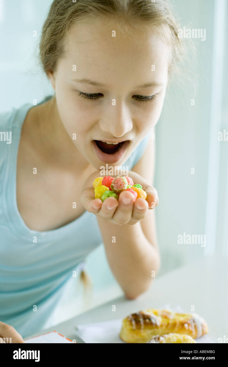 Girl eating sweets Stock Photo - Alamy