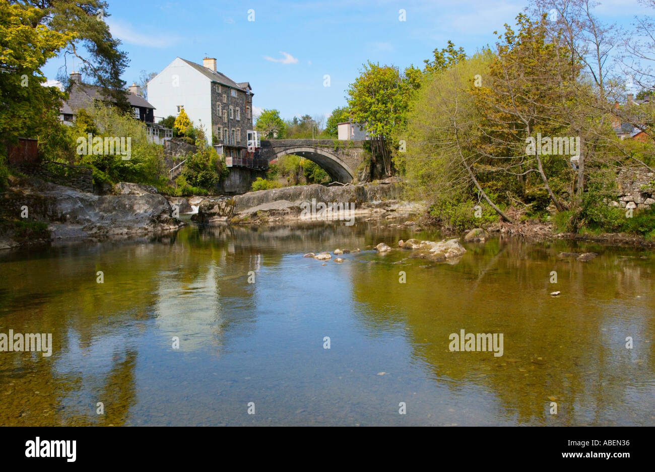 Riverside house and bridge over the River Wye at Rhayader Powys Mid ...