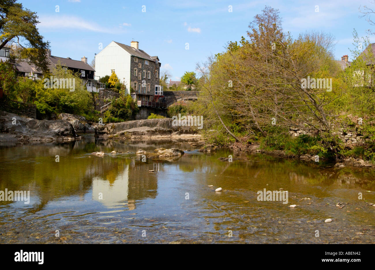 Riverside house and bridge over the River Wye at Rhayader Powys Mid ...