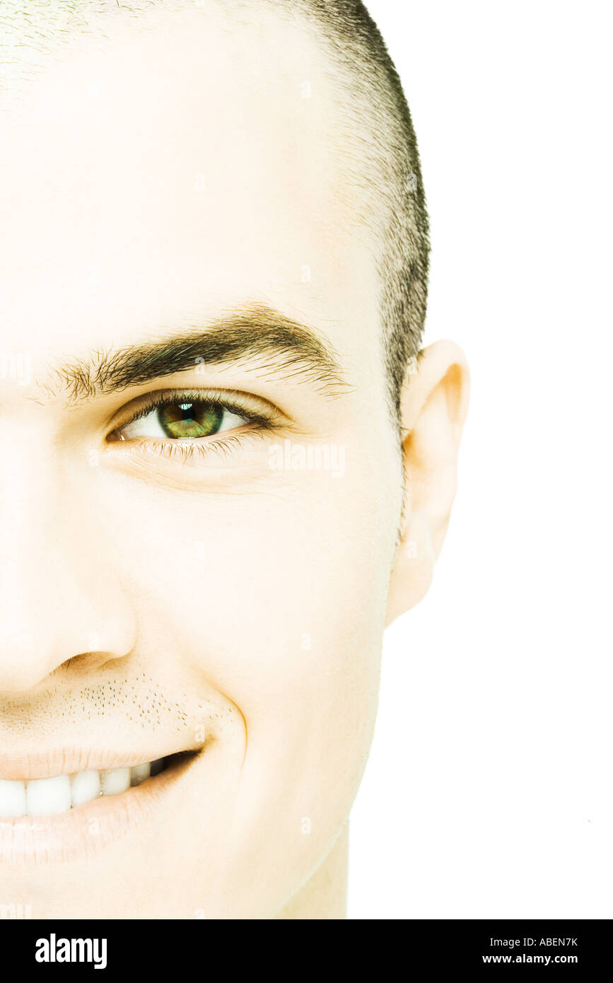 Young man smiling at camera, close-up Stock Photo - Alamy