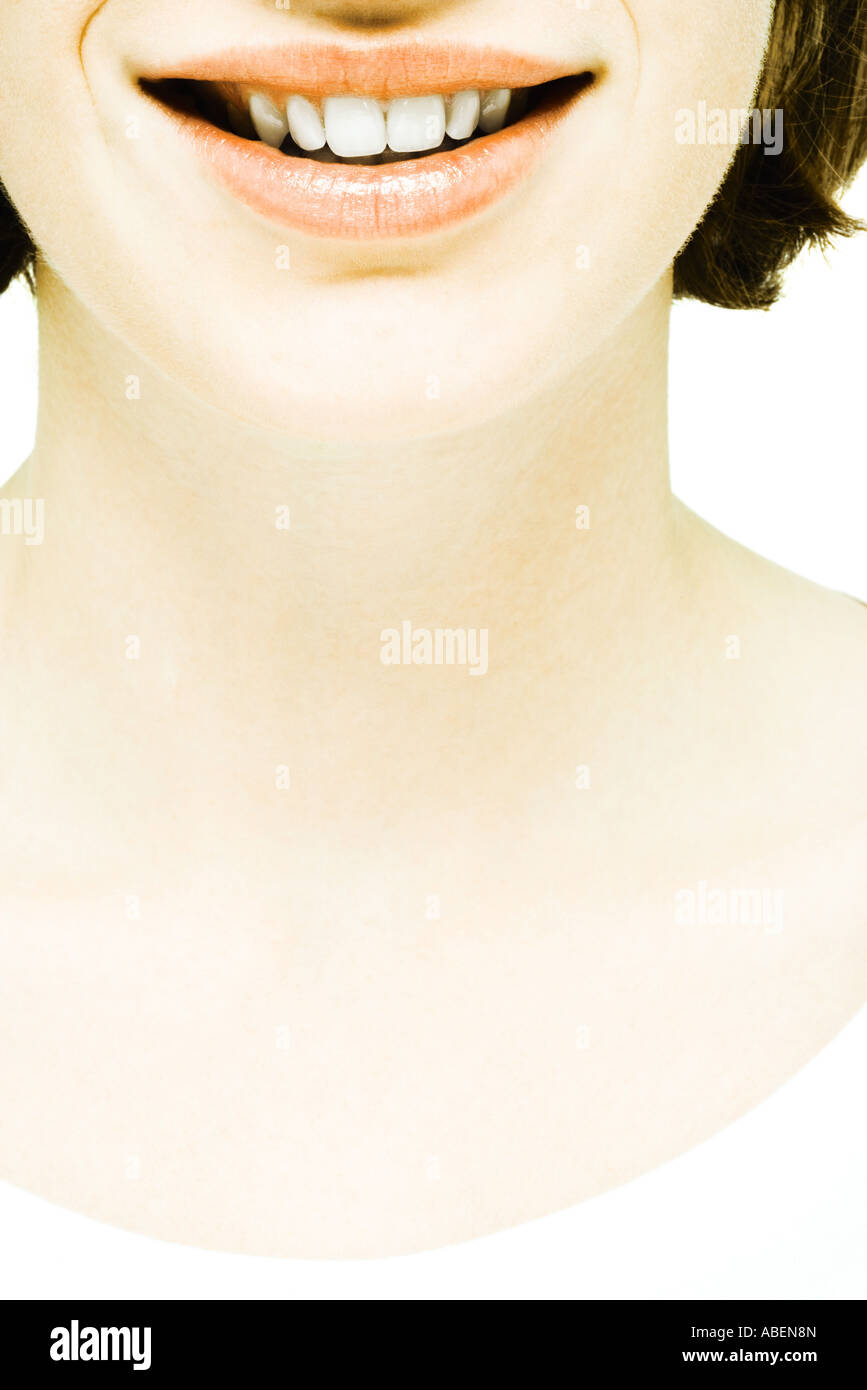Teenage girl smiling, lower part of face and neck, close-up Stock Photo ...