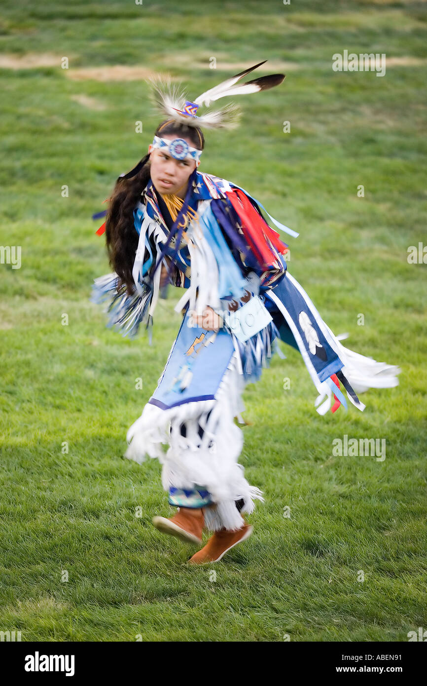 A Native American in full regalia takes part in a fancy dance contest ...