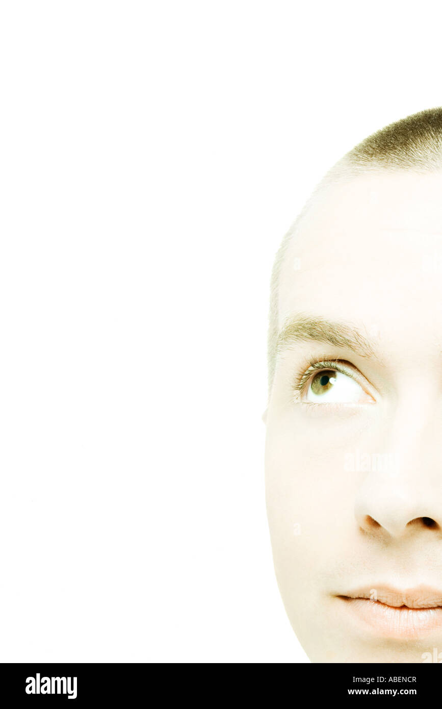 Young man's face, looking up, extreme close-up Stock Photo - Alamy