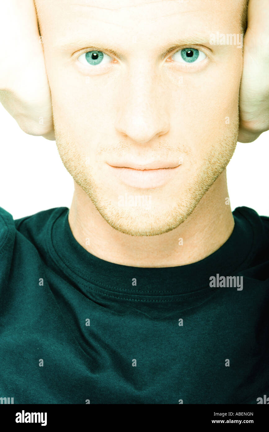 Holding hands over ears hi-res stock photography and images - Alamy