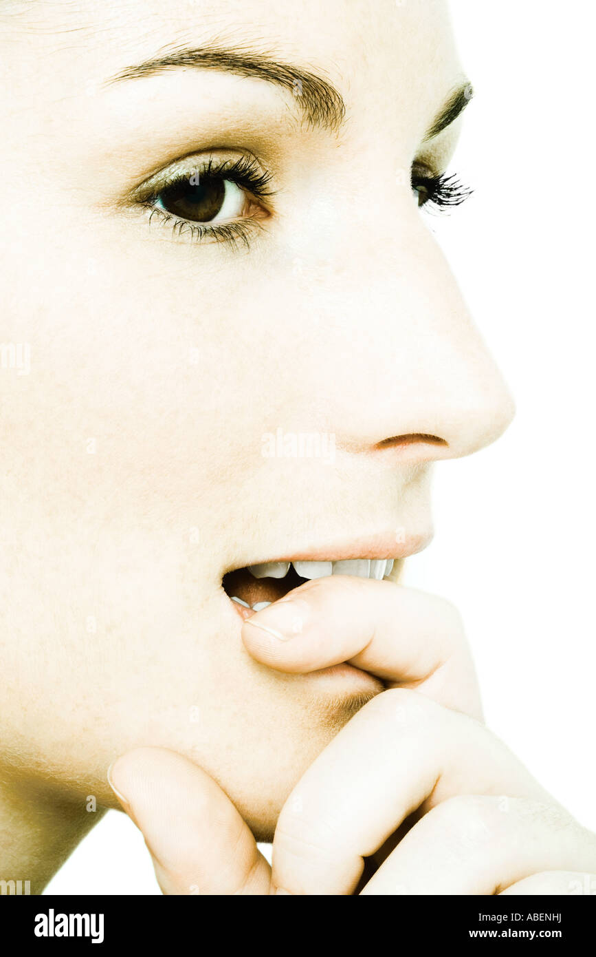 Woman Biting Finger High Resolution Stock Photography and Images - Alamy