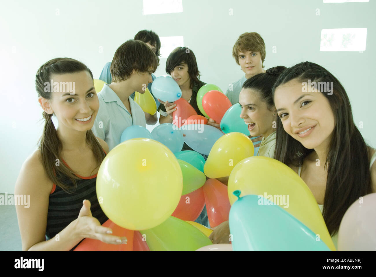 Group of young friends with balloons Stock Photo - Alamy
