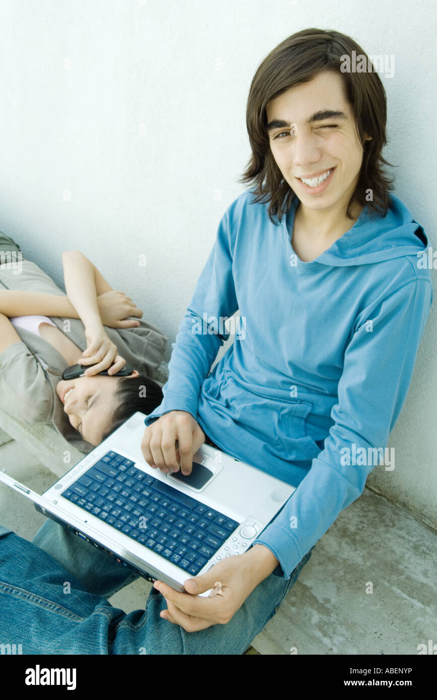 Teen boy using laptop Stock Photo - Alamy