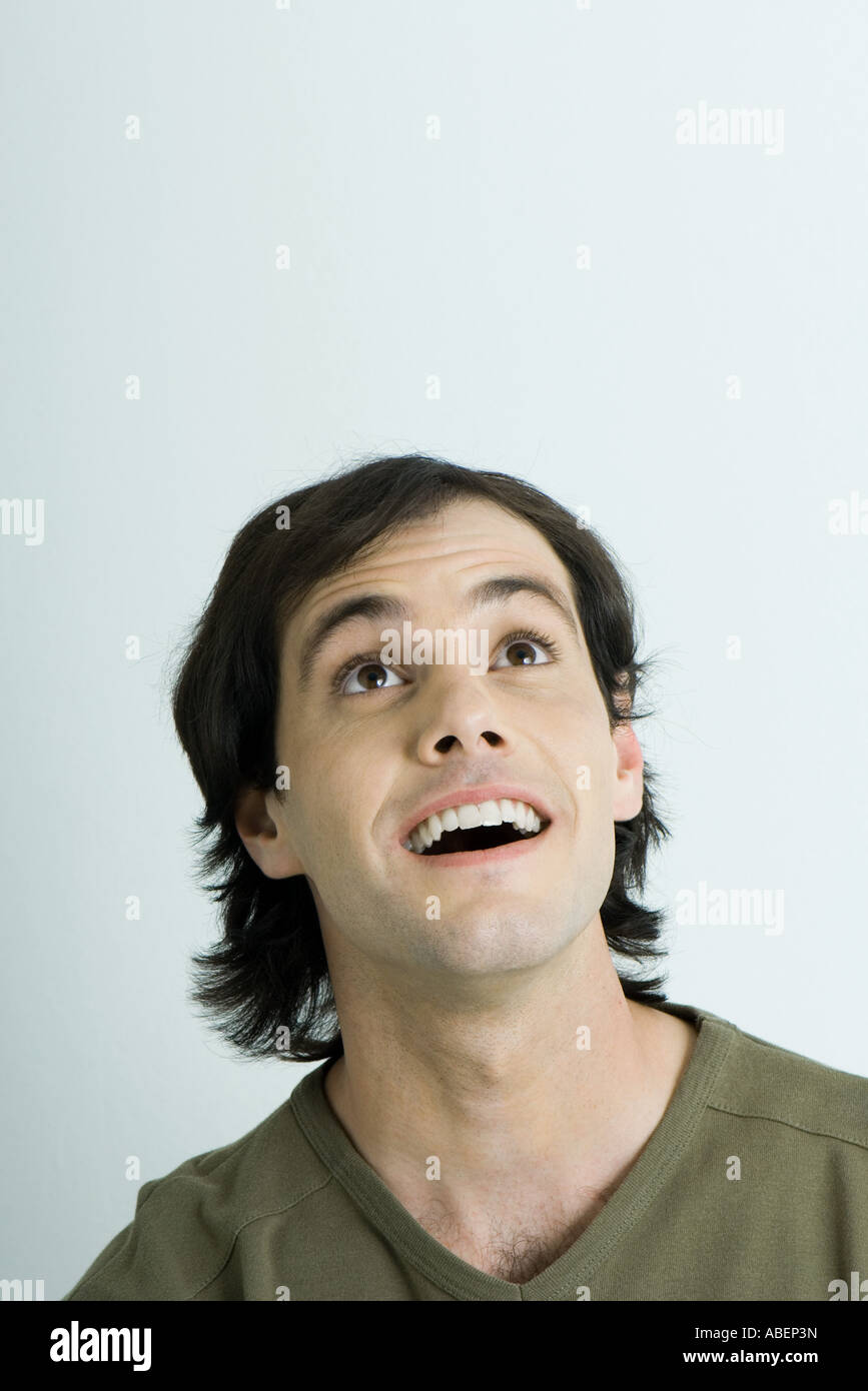 Man, head back, raising eyebrows, portrait Stock Photo - Alamy