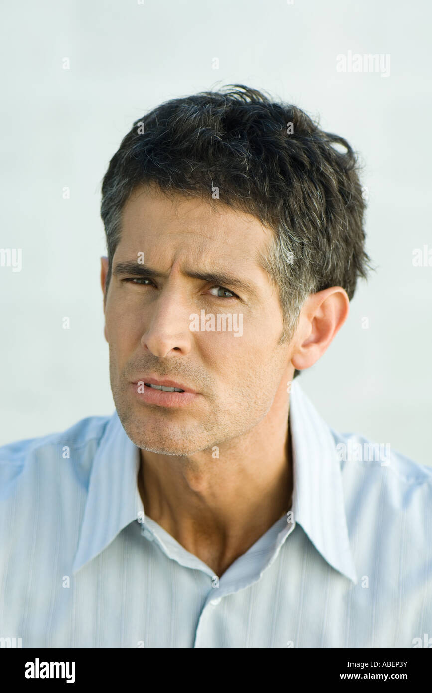 Man furrowing brow portrait hi-res stock photography and images - Alamy