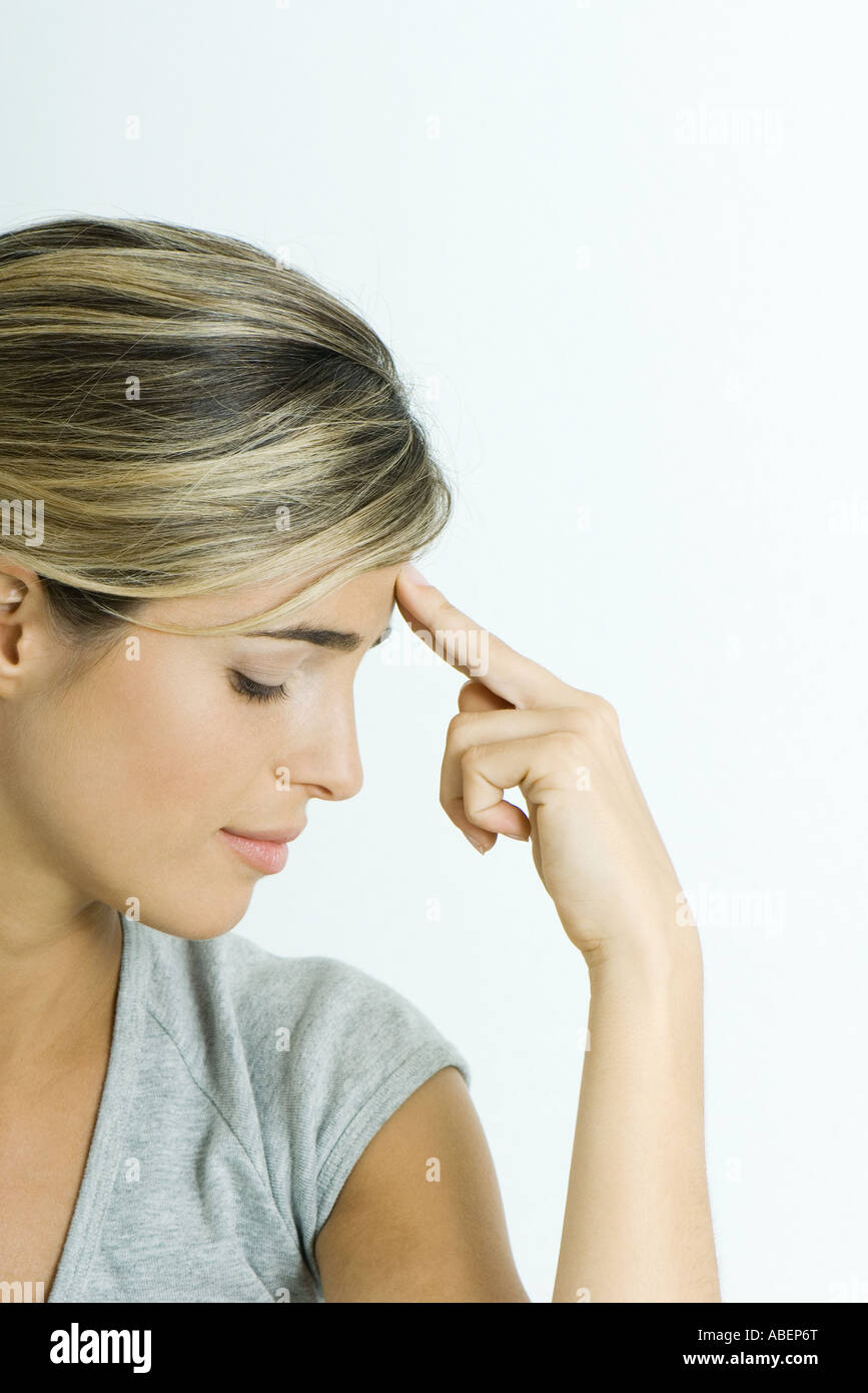 Woman touches hand forehead hi-res stock photography and images - Alamy
