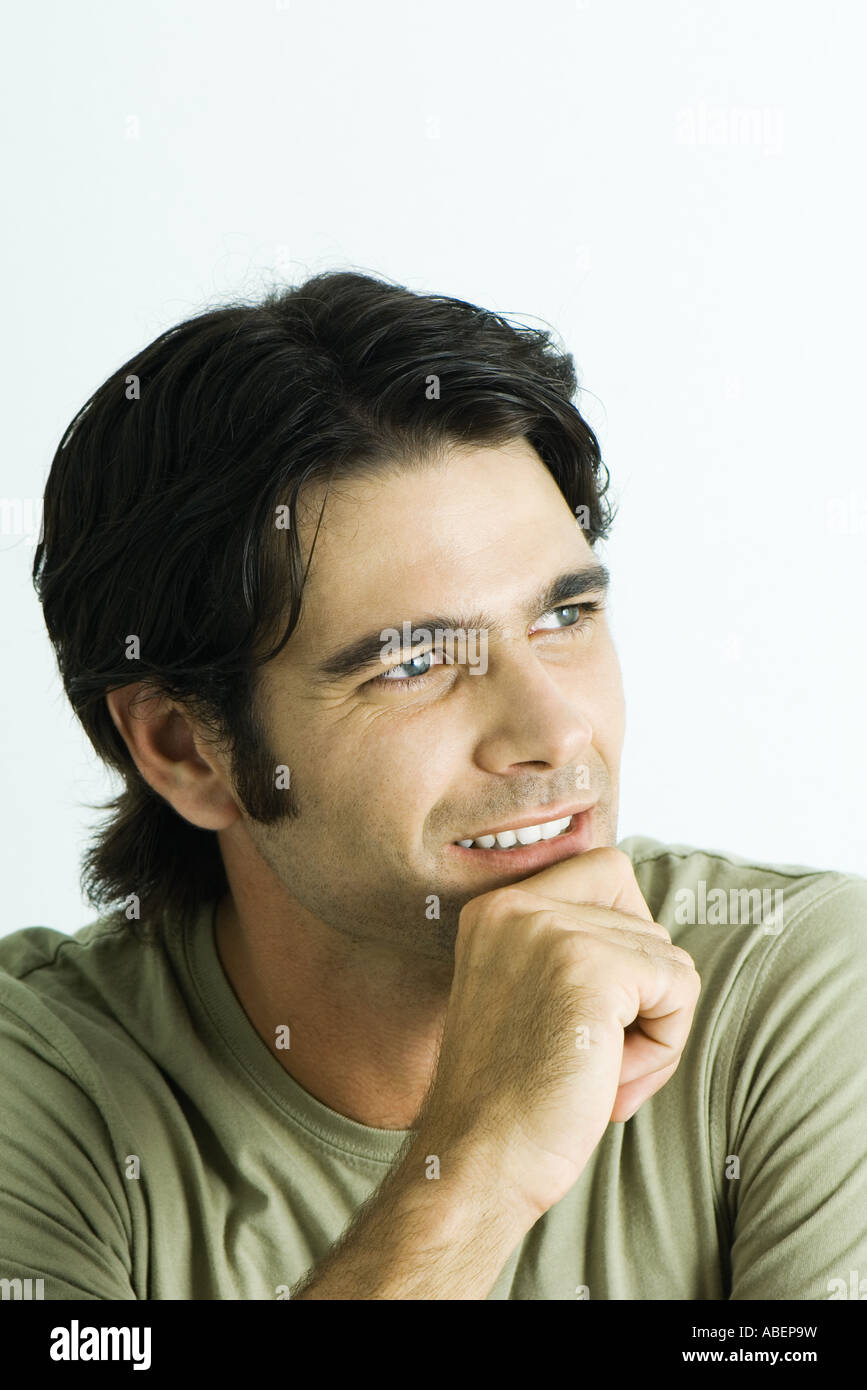 Man, hand under chin, smiling, portrait Stock Photo - Alamy