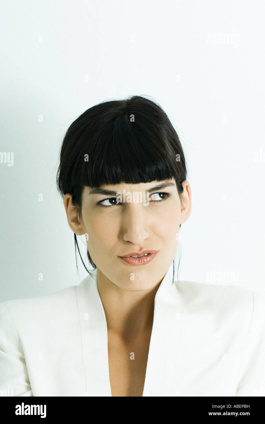 Woman giving sideways look, portrait Stock Photo - Alamy