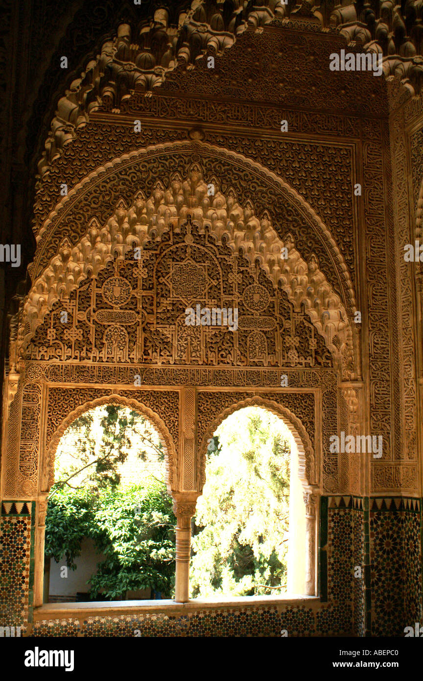 Intricate arches plasterwork windows in moorish palace Alhambra Granada ...