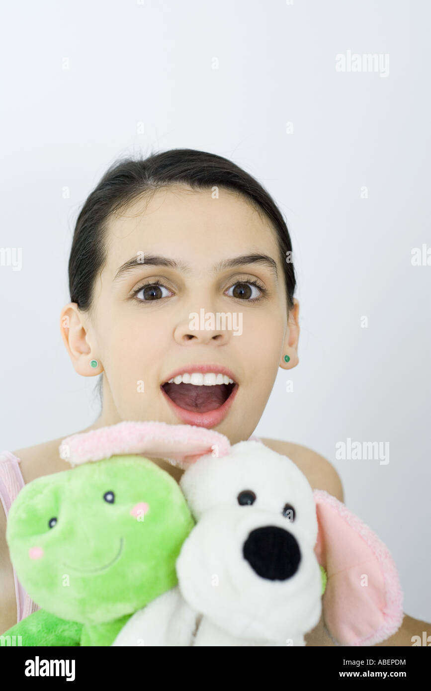 Teen girl holding stuffed animals, portrait Stock Photo - Alamy