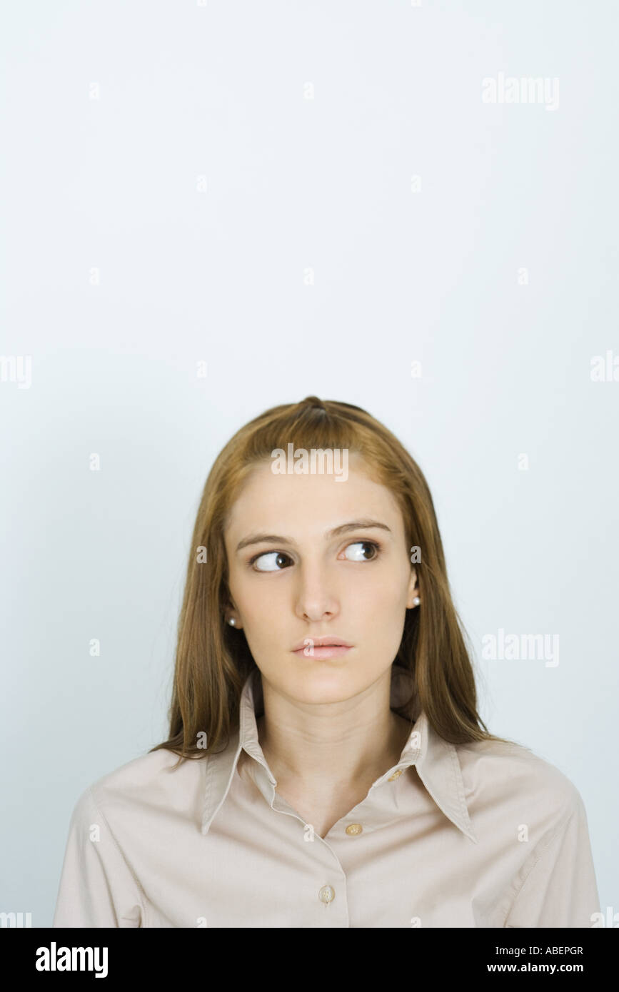 Young woman, glancing to the side, portrait Stock Photo - Alamy