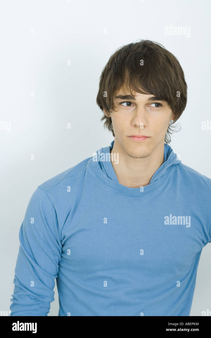 Young man, glancing to the side, portrait Stock Photo - Alamy