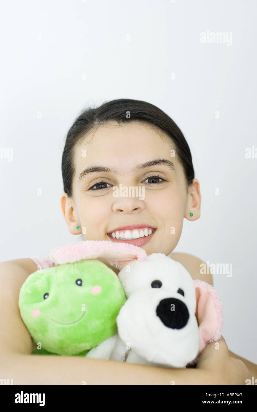 Teen girl holding stuffed animals, portrait Stock Photo - Alamy
