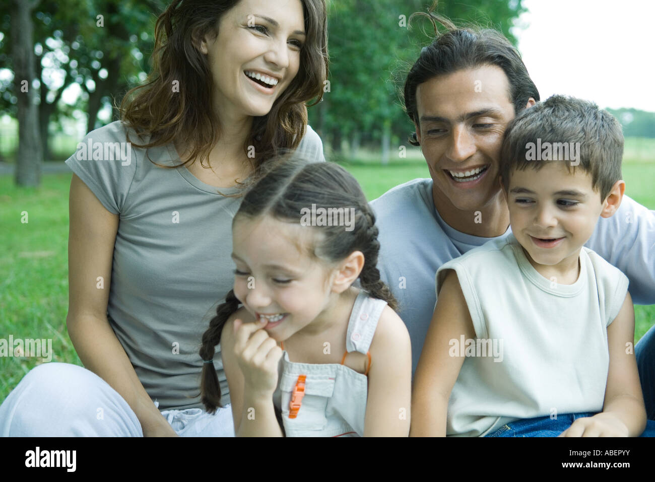 Family outdoors, smiling Stock Photo - Alamy