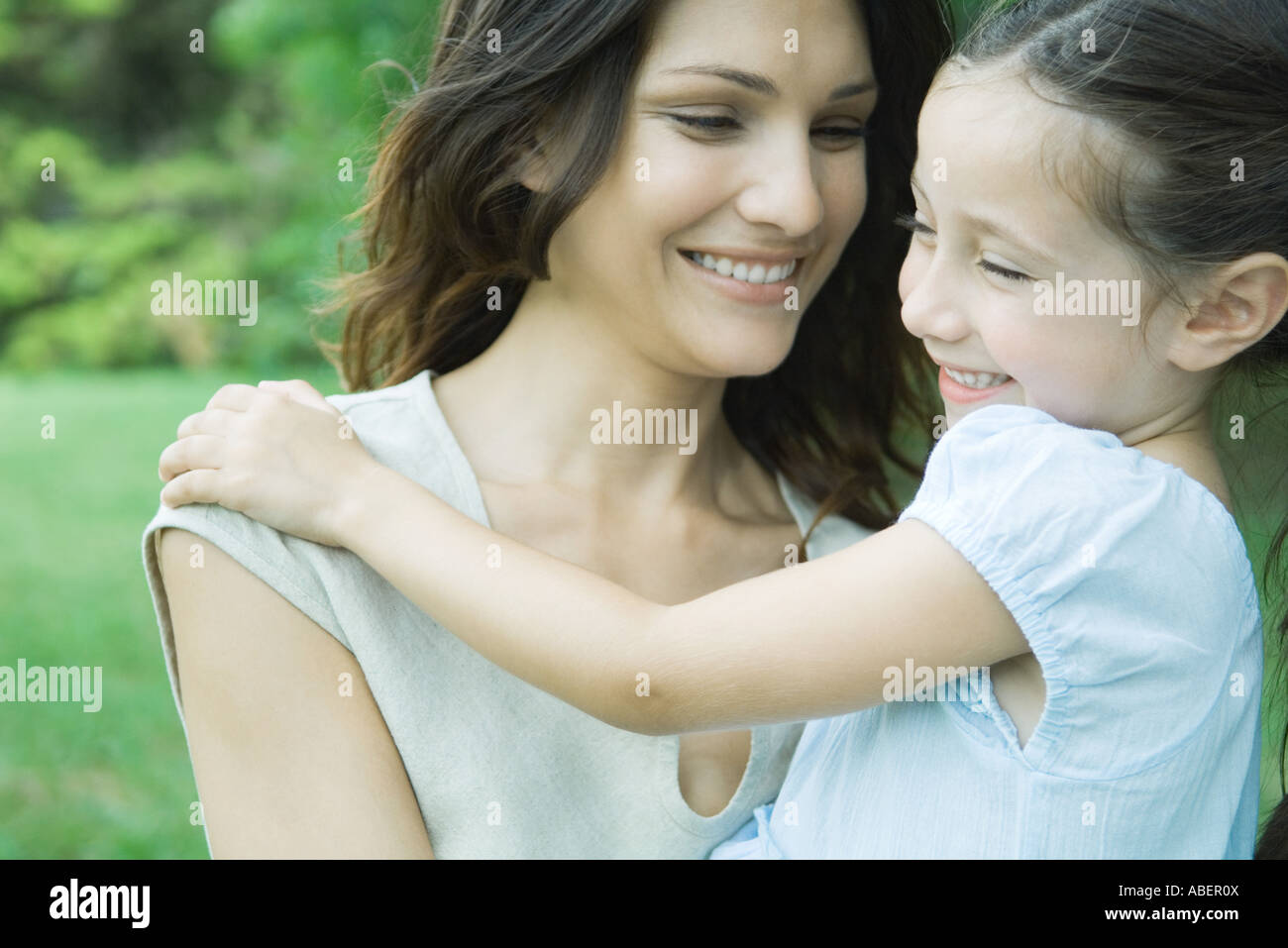 Girl and mother smiling, portrait Stock Photo - Alamy
