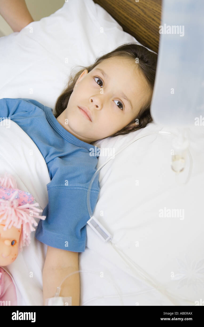 Girl lying in hospital bed Stock Photo - Alamy