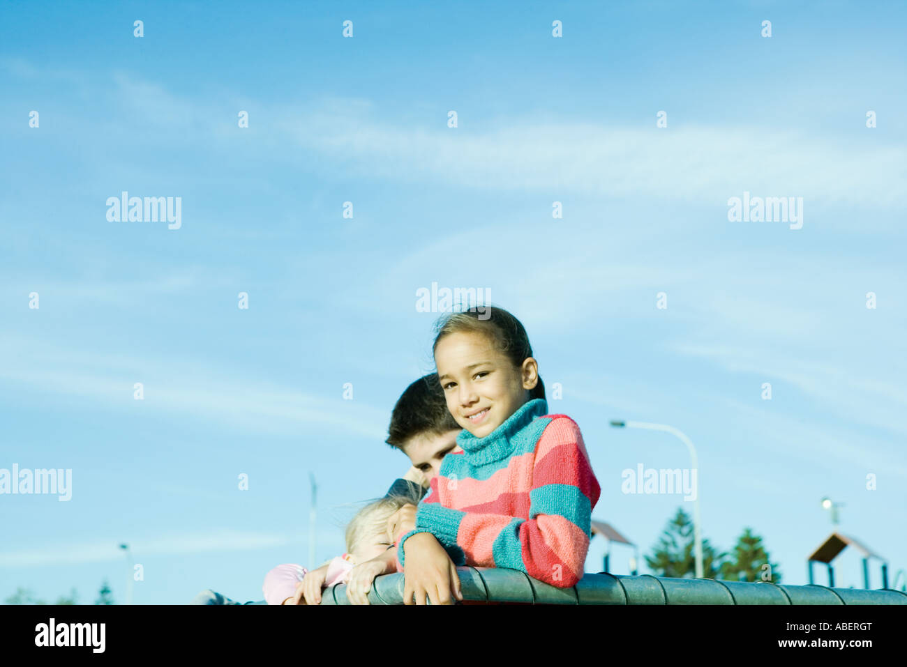 Children standing behind fence Stock Photo - Alamy
